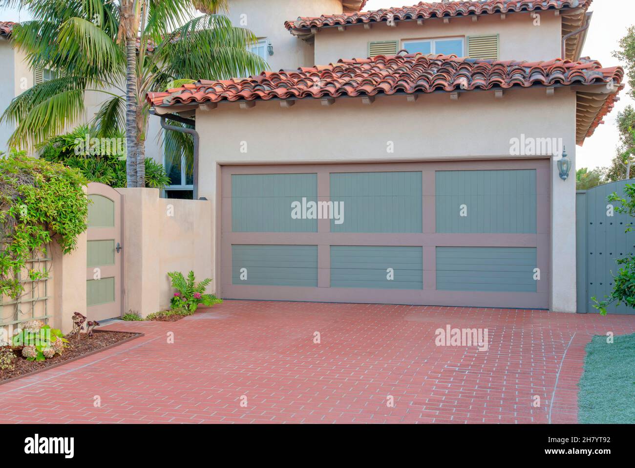 Garage exterior with red bricks driveway at La Jolla, California Stock ...