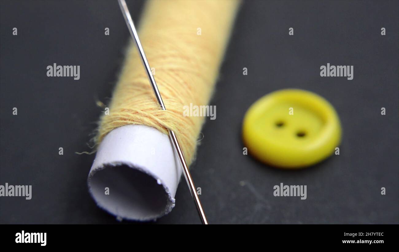 3d illustration - Sewing kit on black background Stock Photo - Alamy