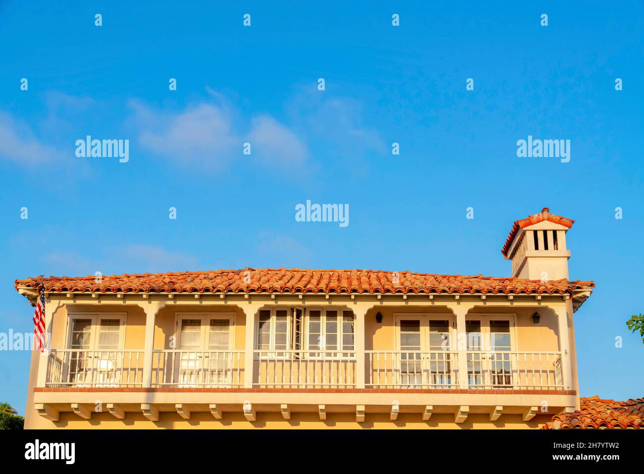 Terrace of a mediterranean style house with US flag at La Jolla ...
