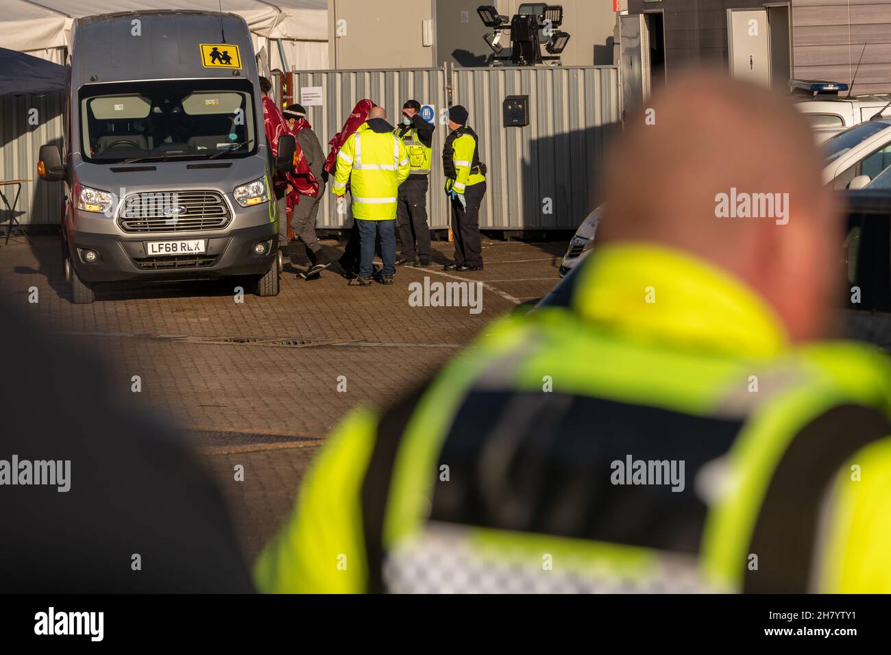 Border force immigration officers and asylum seekers who have crossed ...