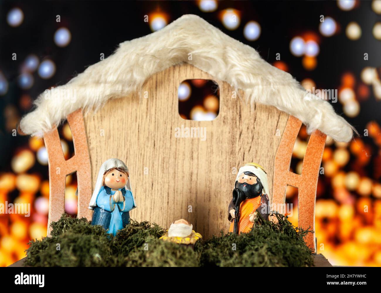 Christmas nativity scene with figurines on a background of yellow ...