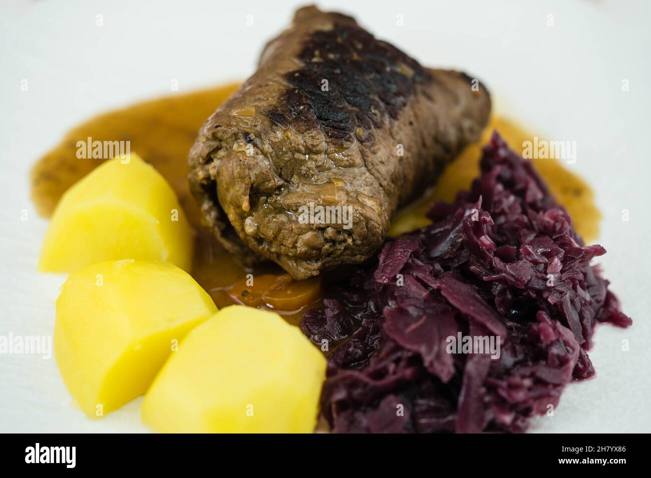 traditional german Food Beef Roulade with red cabbage Stock Photo - Alamy