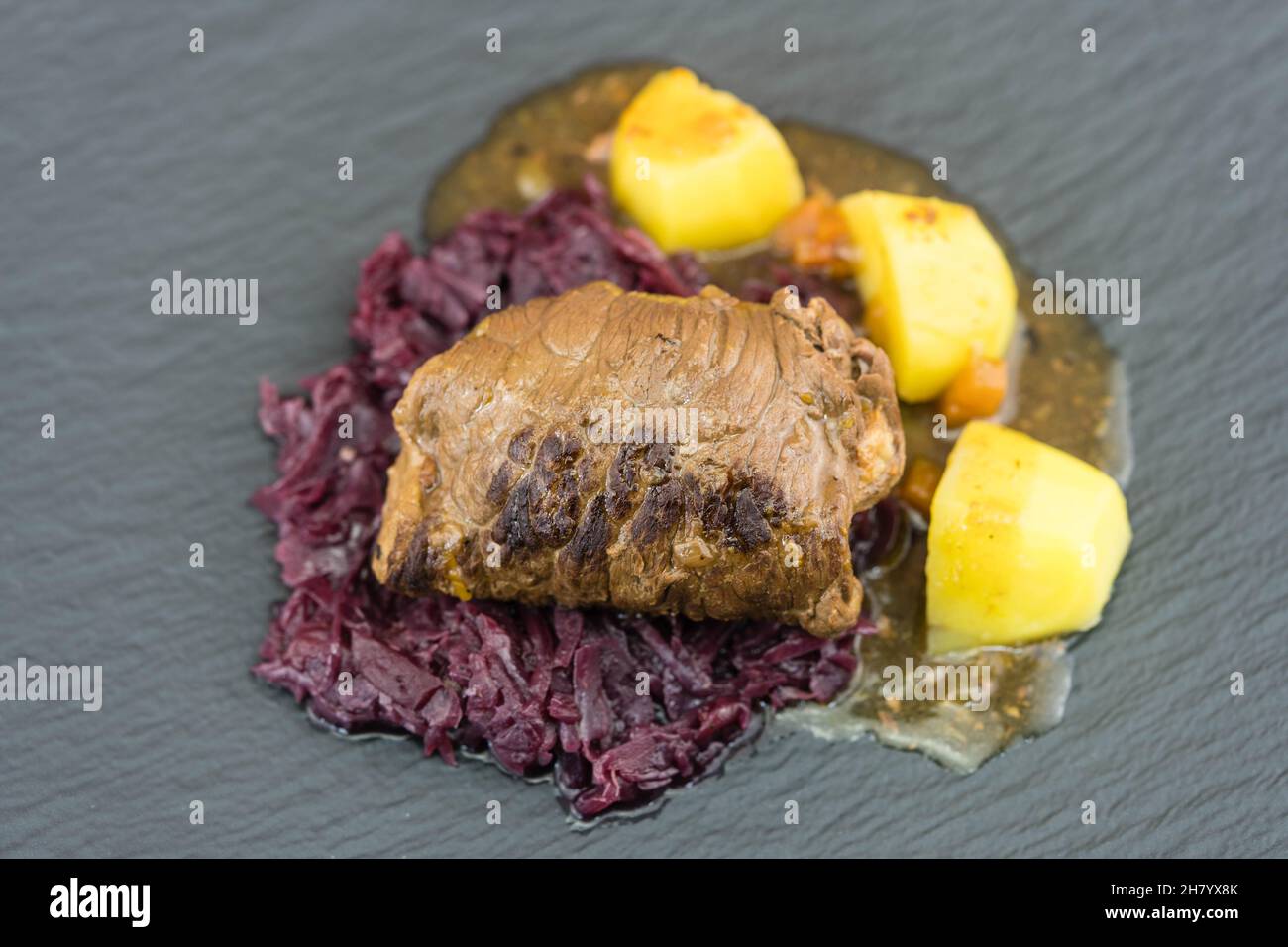 traditional german Food Beef Roulade with red cabbage Stock Photo - Alamy