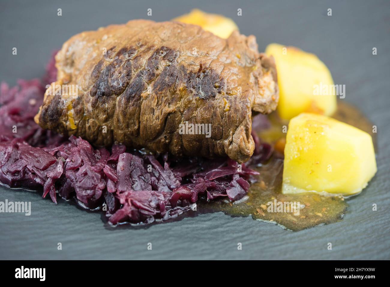 traditional german Food Beef Roulade with red cabbage Stock Photo - Alamy