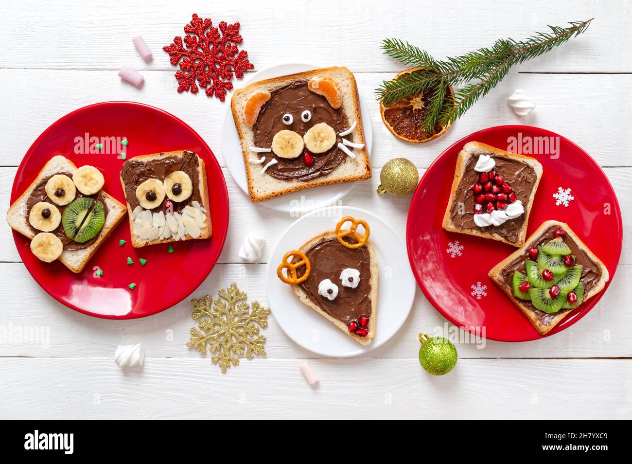 Assorted funny sandwiches on plates, top view. The idea of a menu for a ...