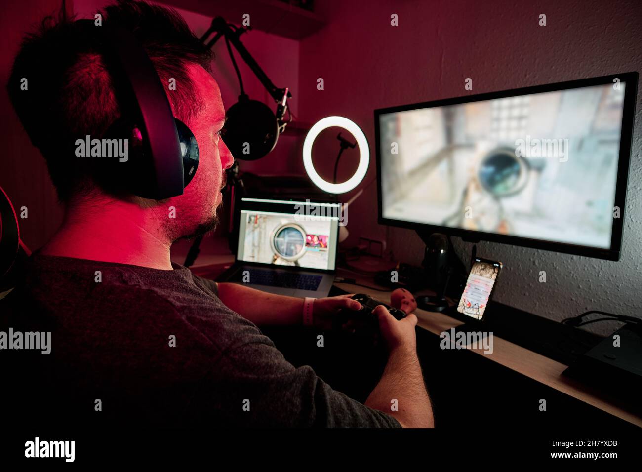 a gamer playing and streaming live with microphones and cameras Stock ...