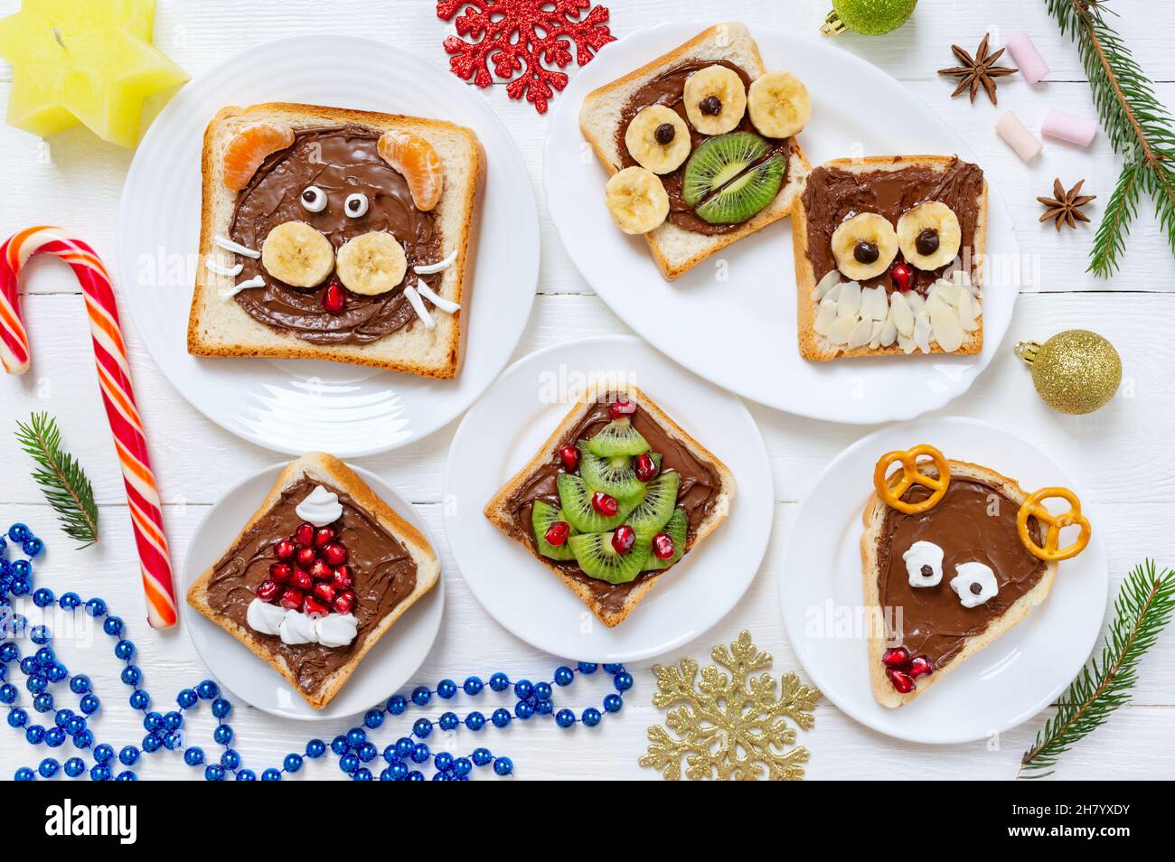 Assorted funny animals toasts with chocolate, fresh fruit, marshmallows ...