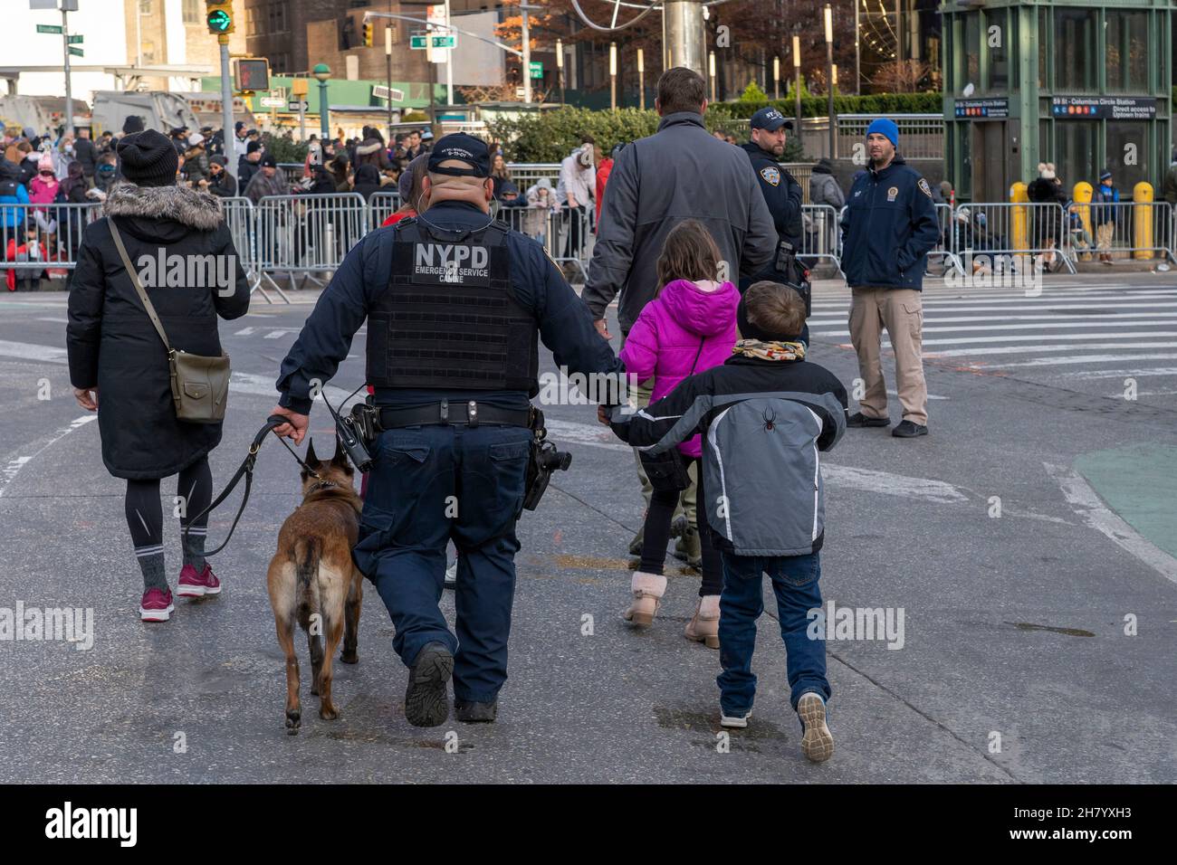 NYPD K9 unit officer and his son attend the 95th Annual Macy's ...