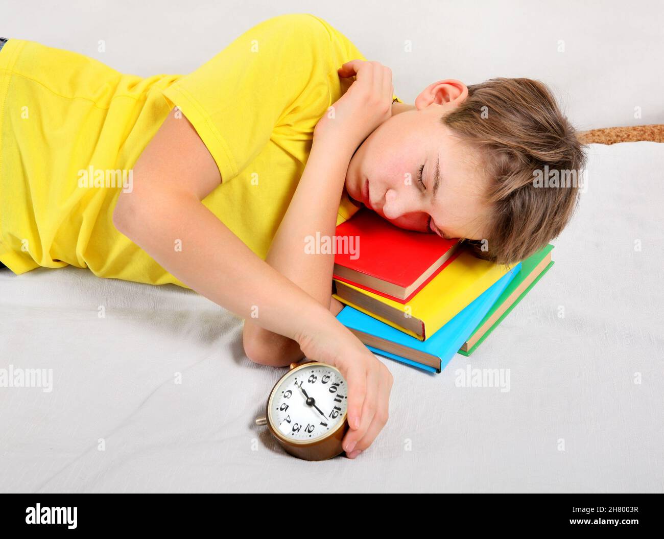 Child asleep bed clock hi-res stock photography and images - Alamy