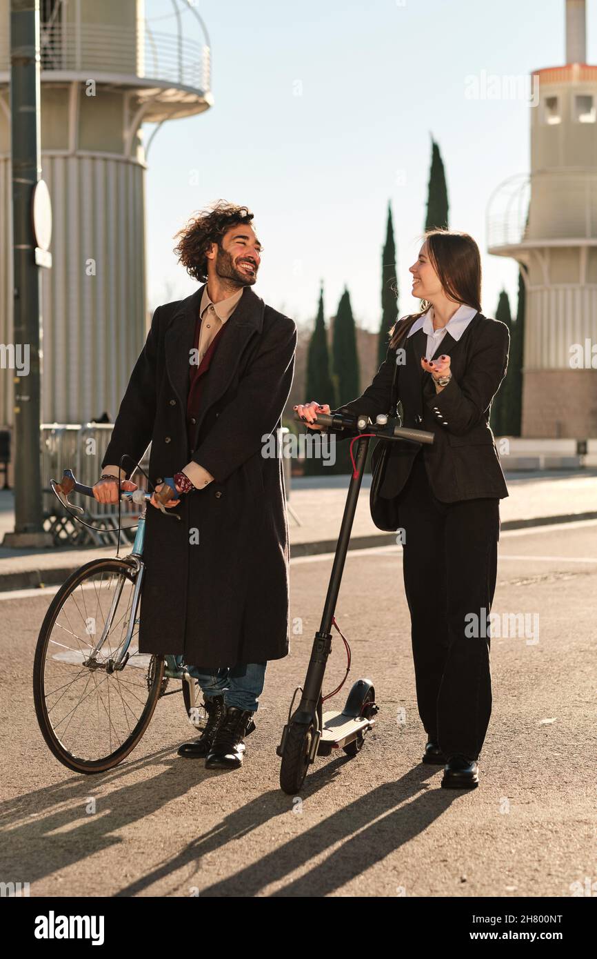 Two friends walking together outdoors Stock Photo - Alamy