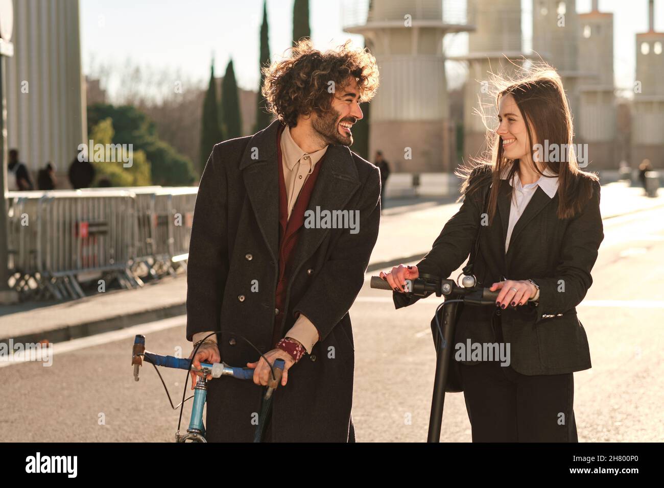 Two friends walking and laughing together outdoors Stock Photo - Alamy