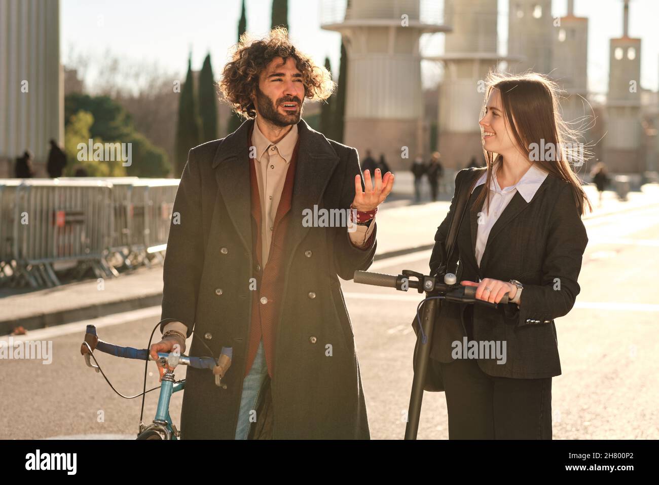 Two friends walking together outdoors Stock Photo - Alamy