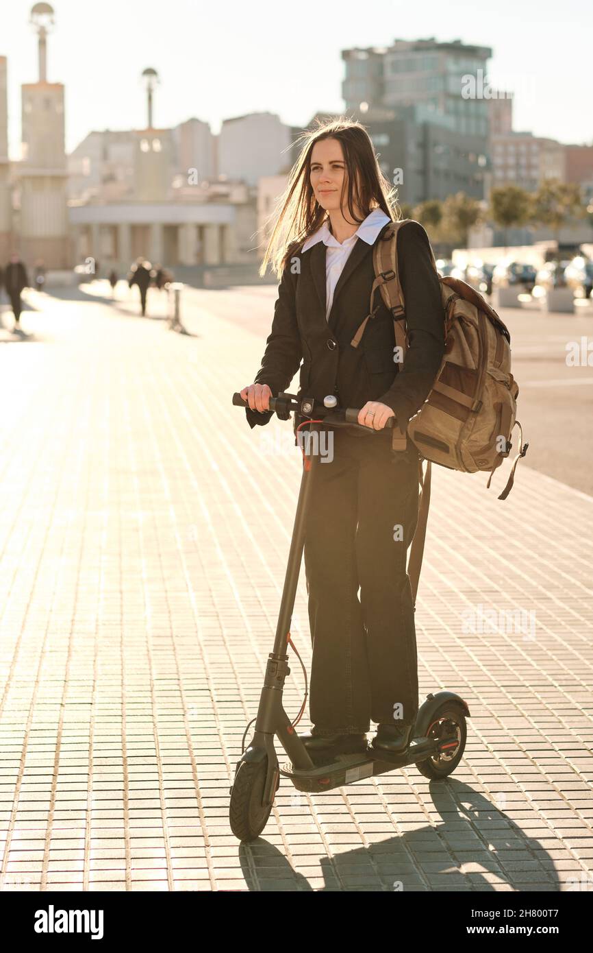 Woman riding e scooter hi-res stock photography and images - Alamy