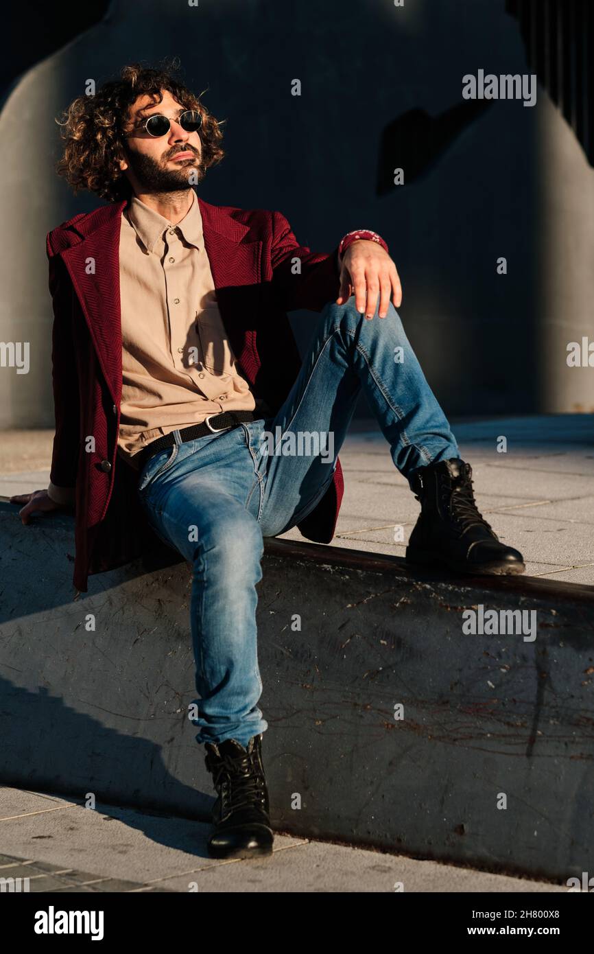 Young man beard sitting relaxed hi-res stock photography and images - Alamy