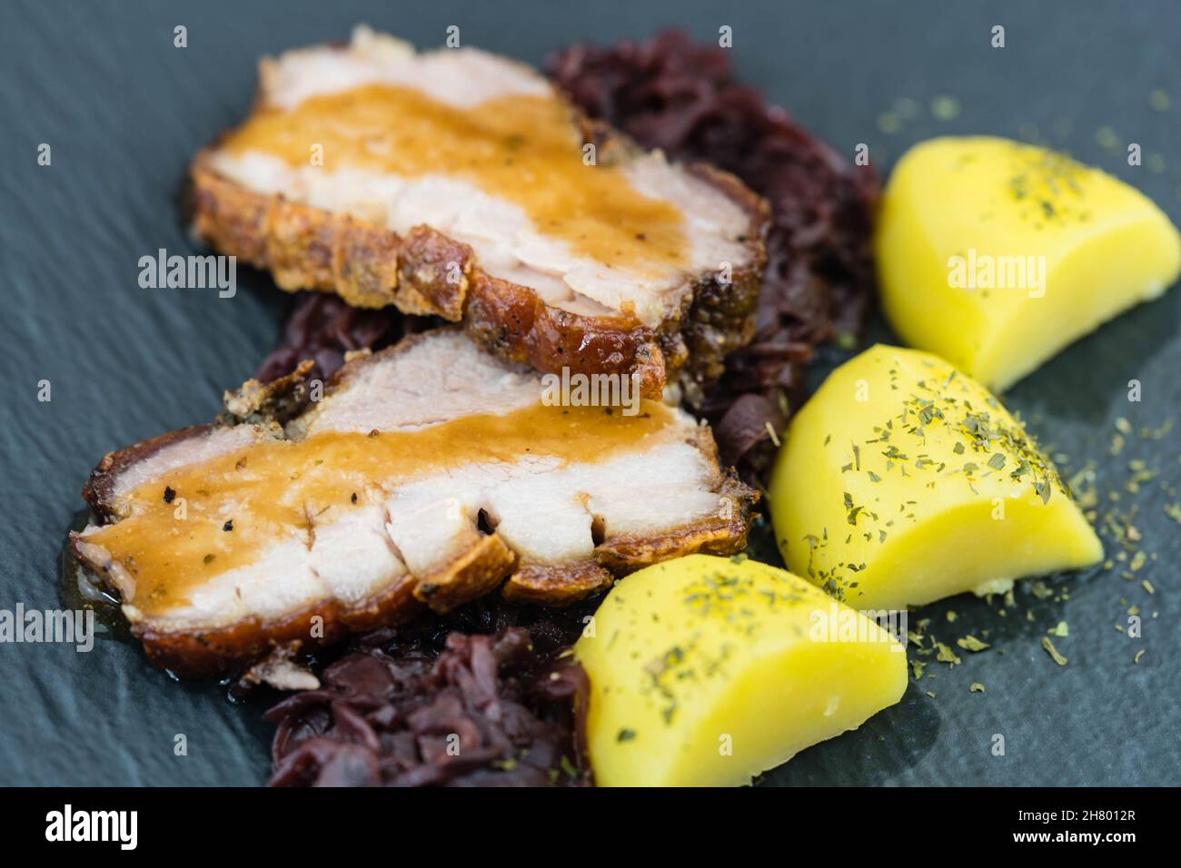 Pork Royal a traditional roast pork with red cabbage and potatoes Stock ...