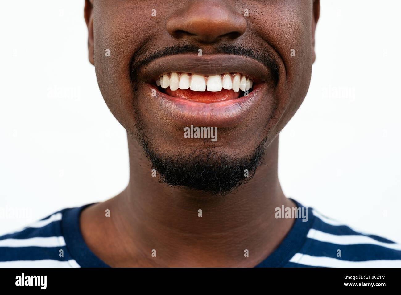 Crop unrecognizable positive African American male with black beard ...