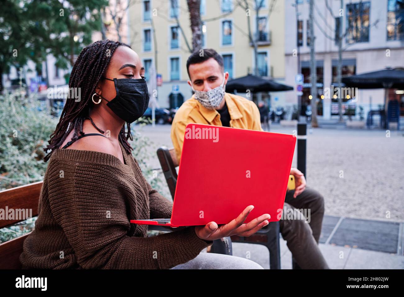 People with face masks and keeping distance Stock Photo - Alamy