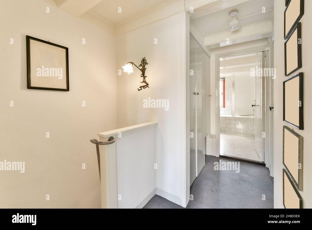 Interior of corridor with empty decorative photo frames hanging on ...