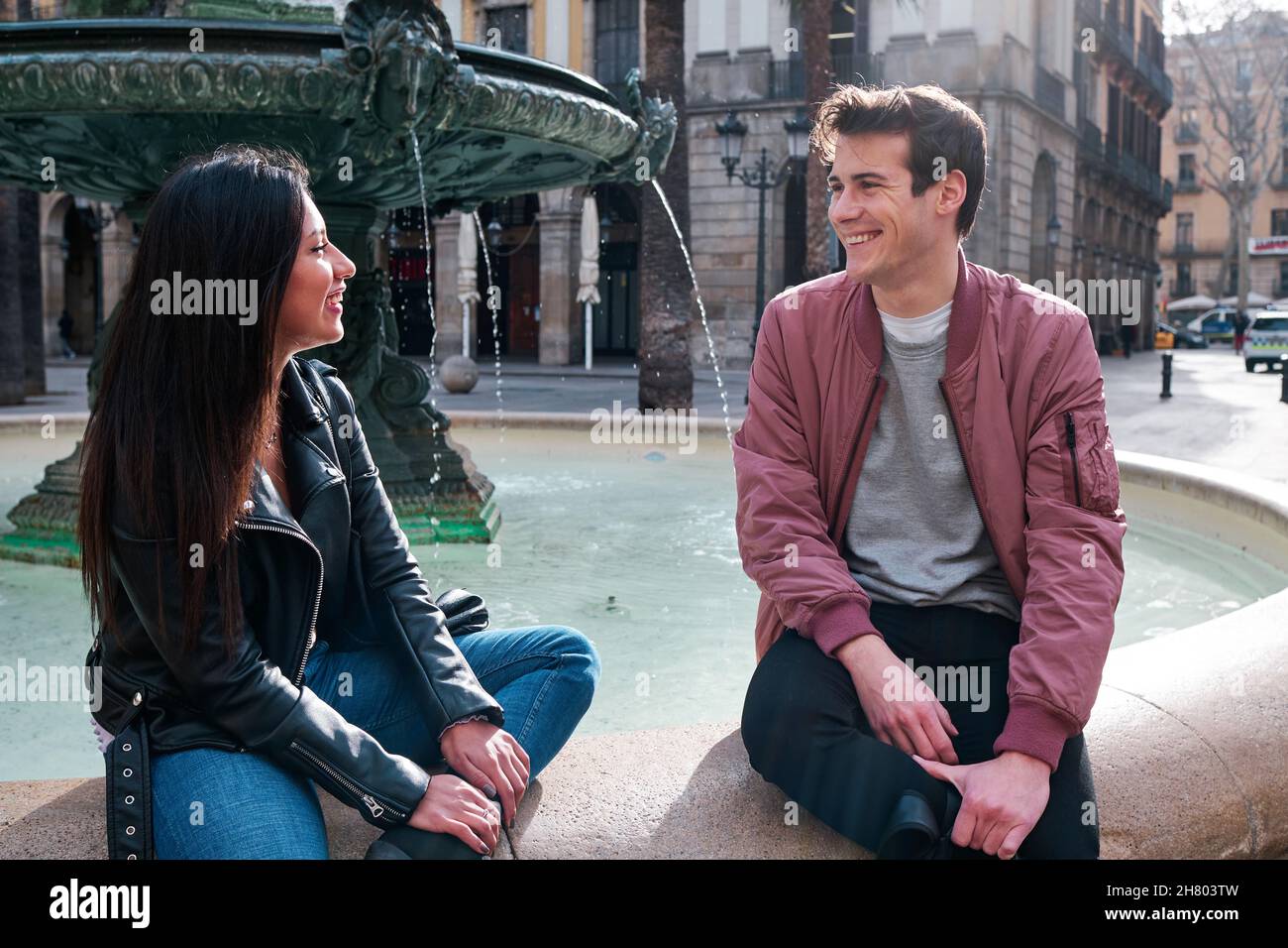 Two friends spending good time together and talking outdoors Stock ...
