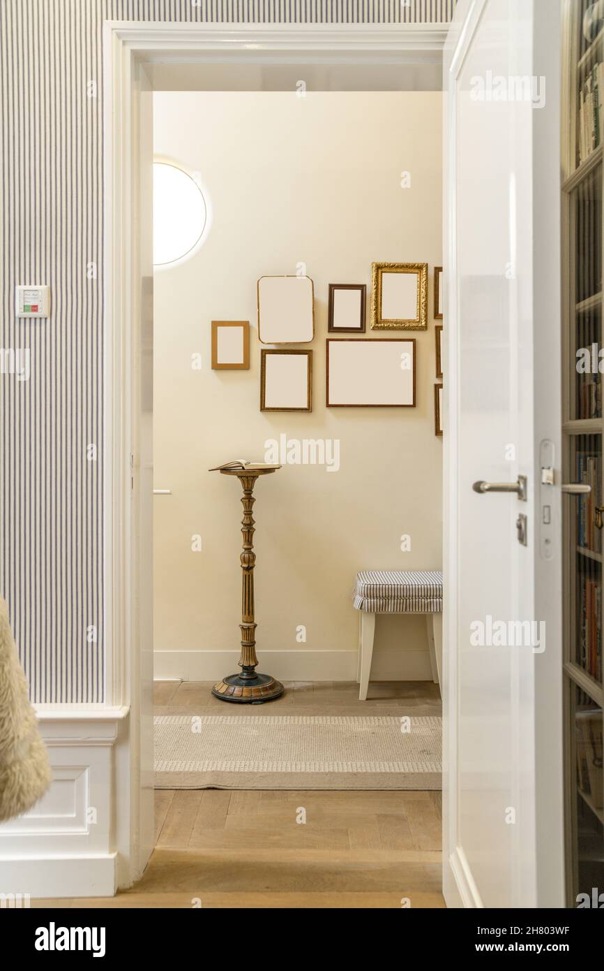 Calm male farmer in blue uniform looking at camera while standing in ...