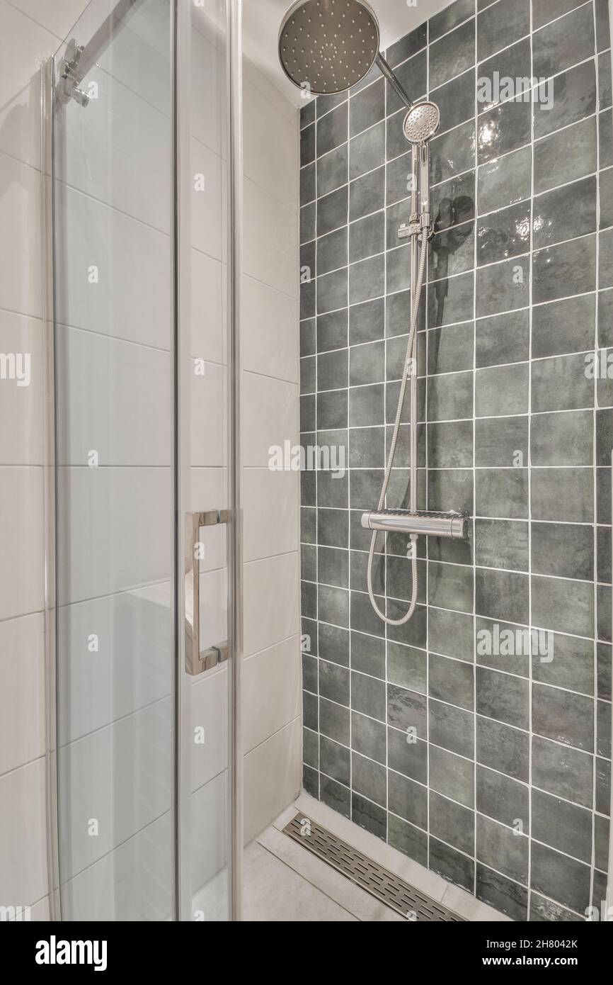 Shower cubicle interior with two shower heads and one transparent ...