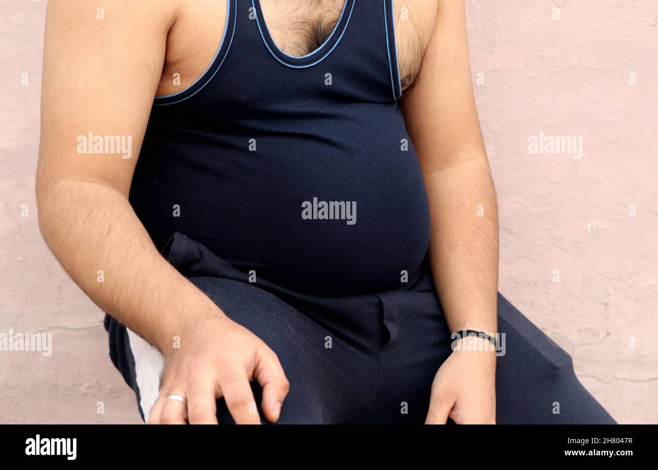 A portrait of a asian fat man show out his body and big belly. Concept ...