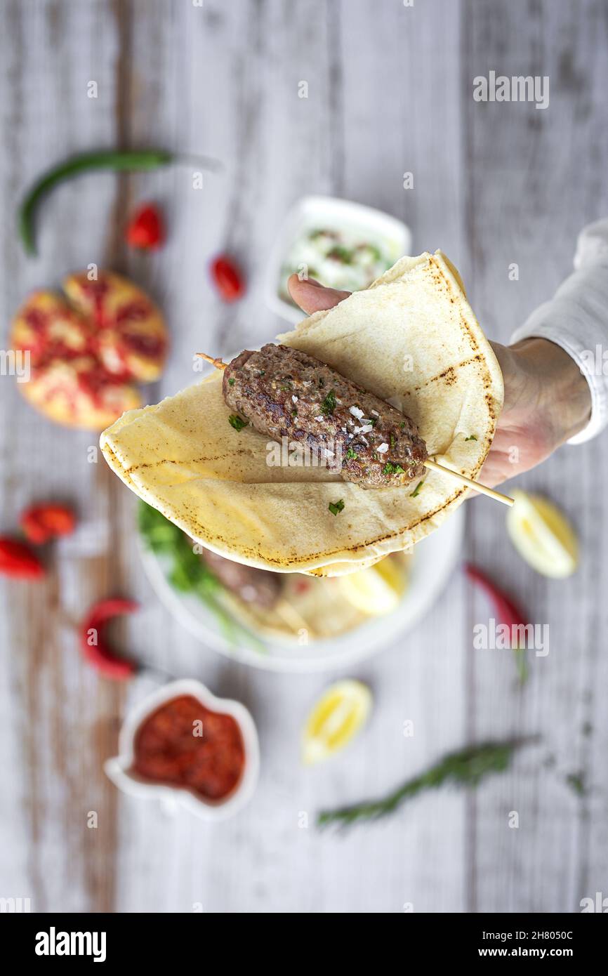 Traditional homemade kafta or kofta kebab beef and lamb with tomato ...