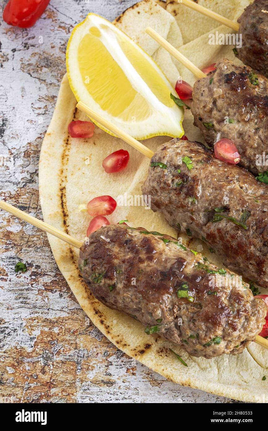 Traditional homemade kafta or kofta kebab beef and lamb with tomato ...