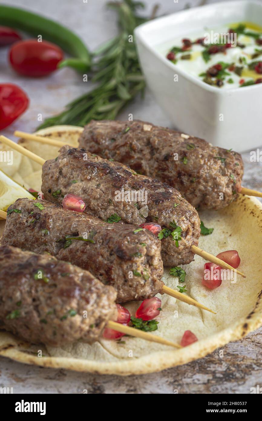 Traditional homemade kafta or kofta kebab beef and lamb with tomato ...