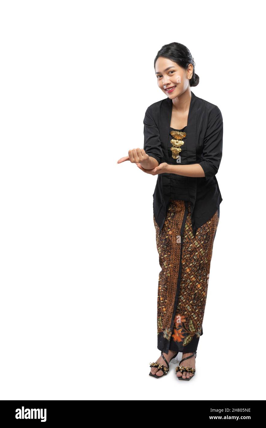 beautiful woman wearing traditional Javanese clothes presenting ...
