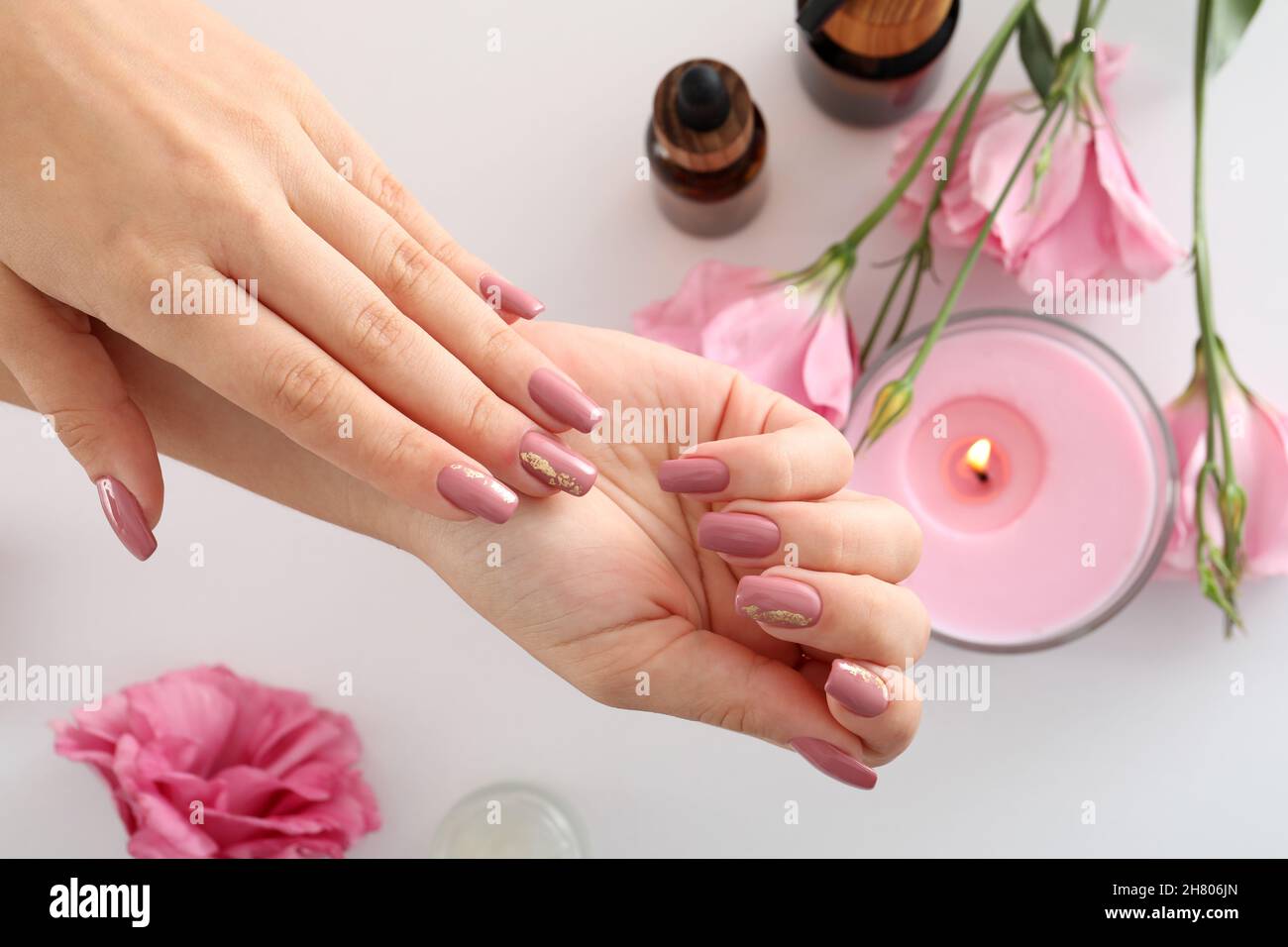 Concept of hand care with cosmetics on white background Stock Photo - Alamy
