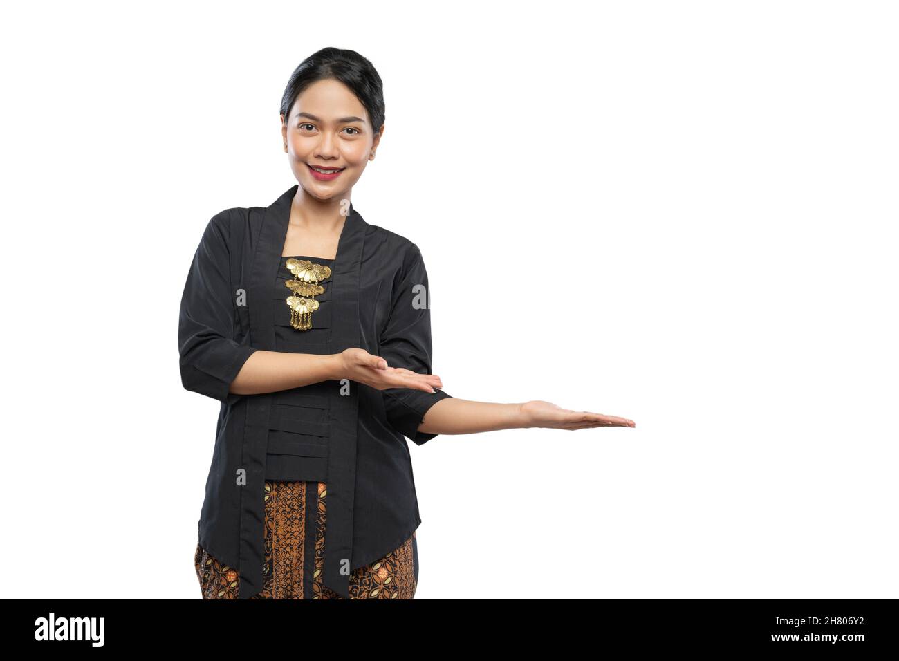 beautiful woman wearing traditional Javanese clothes presenting Stock ...