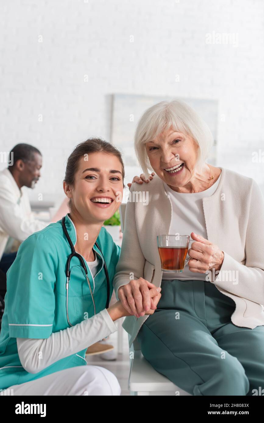Cheerful nurse hi-res stock photography and images - Alamy