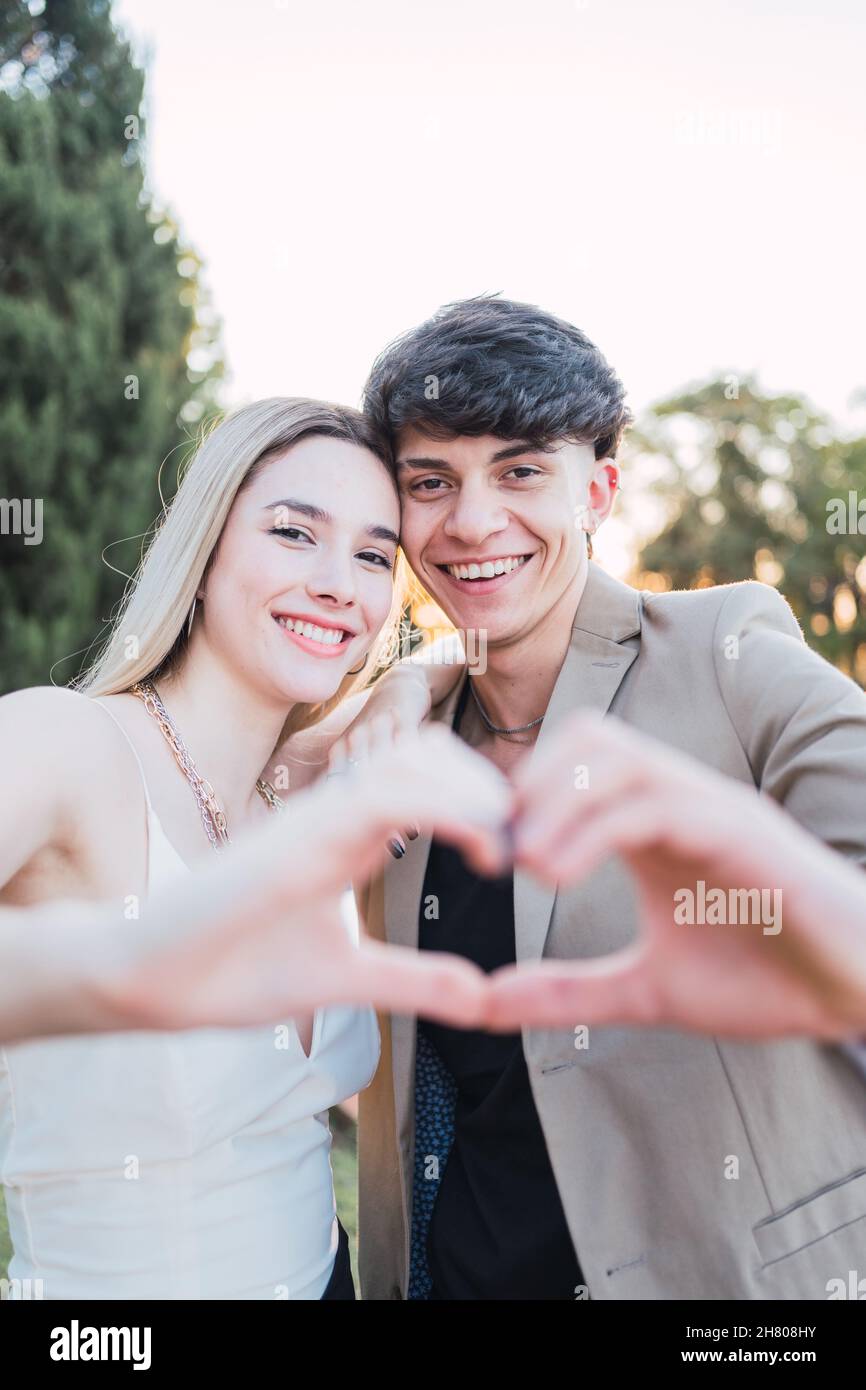 Delightful loving man and Woman smiling and looking at camera while ...
