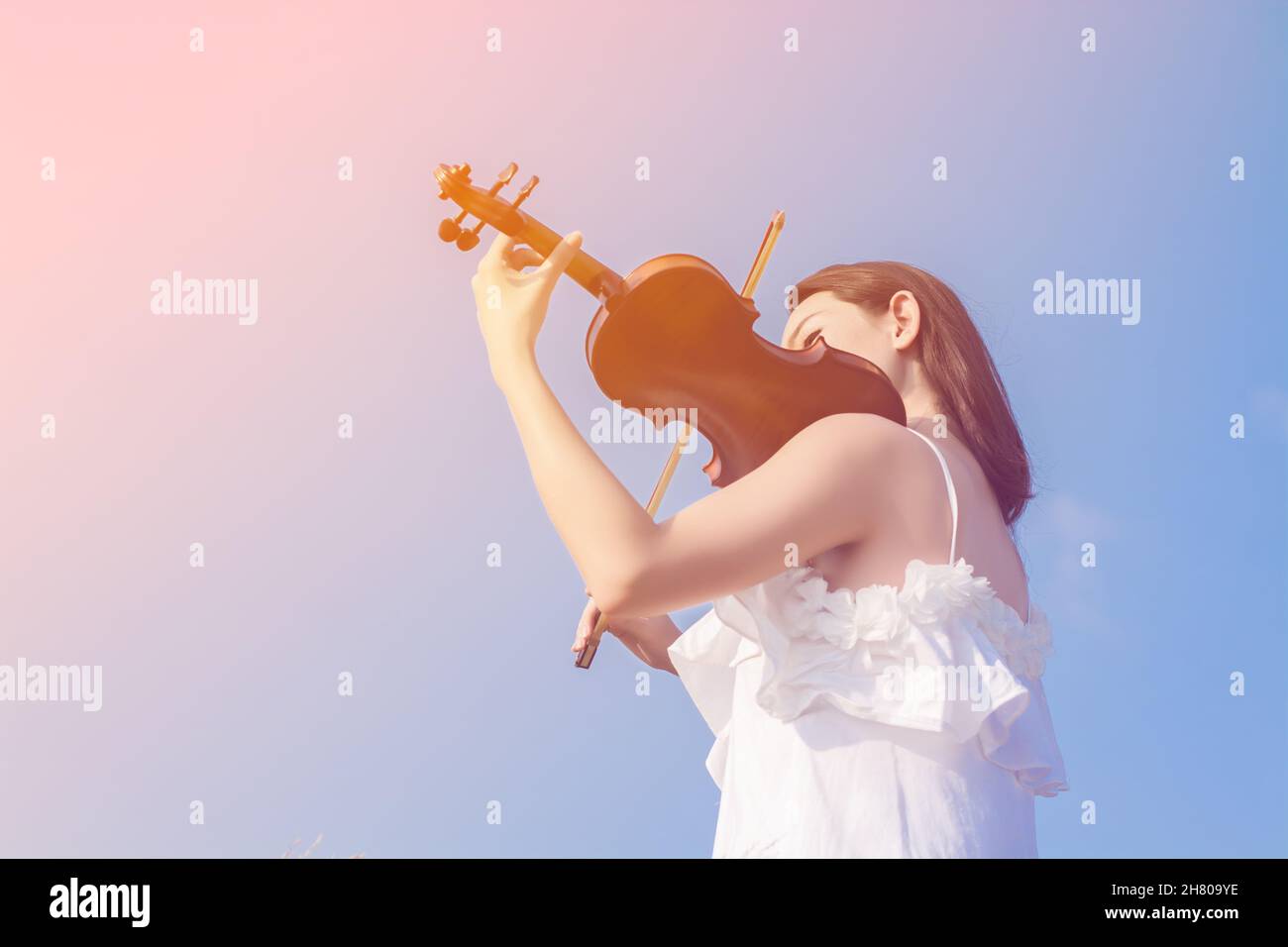 Beautiful girl playing violin orchestra hi-res stock photography and ...