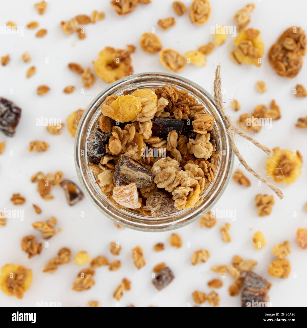 crunchy granola in glass jar isolated on white background, top view ...