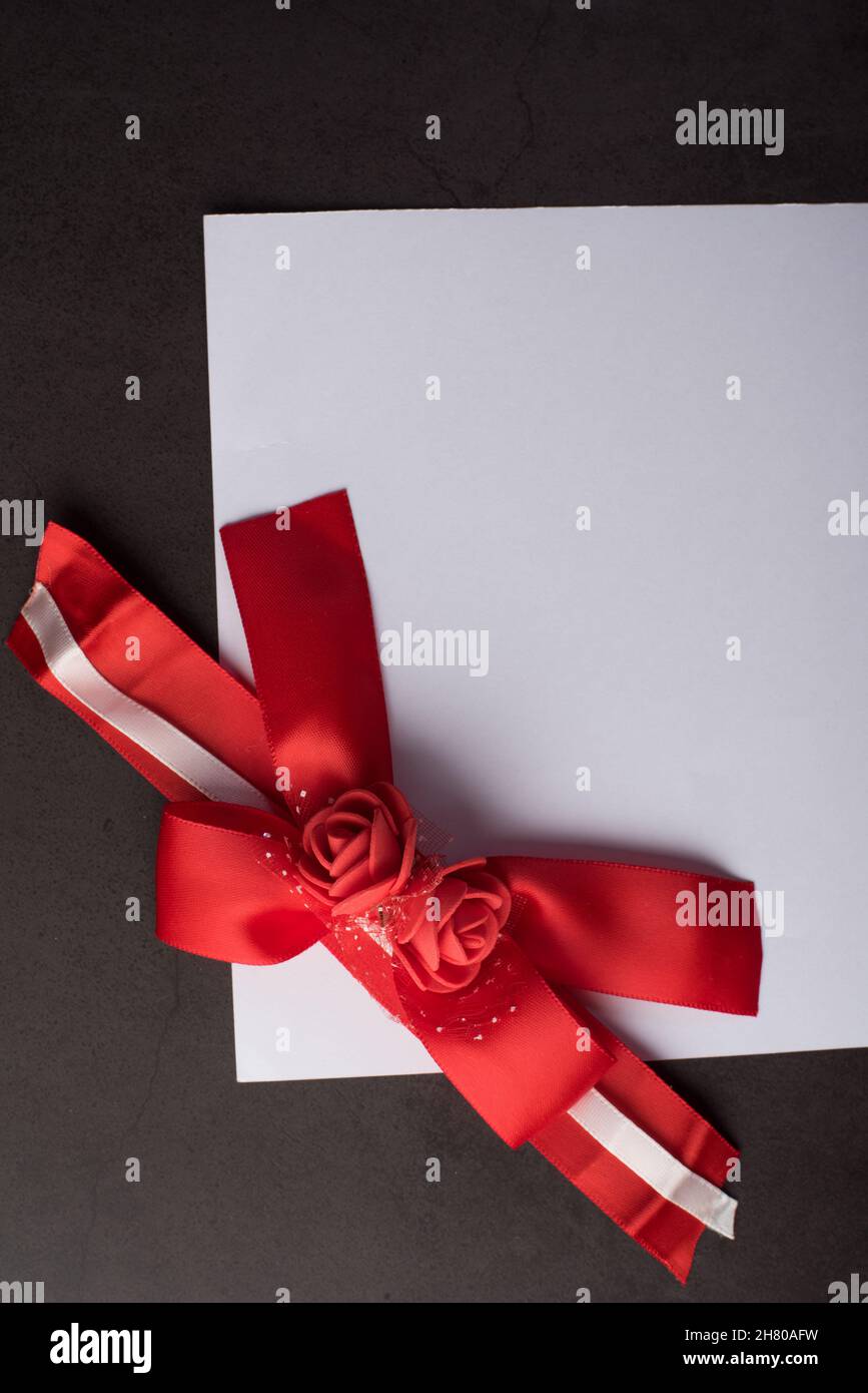 rose ribbon with white paper Stock Photo - Alamy