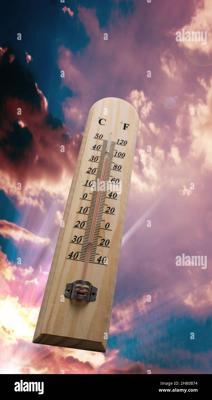 Wooden thermometer on the sky , Hot weather Stock Photo - Alamy