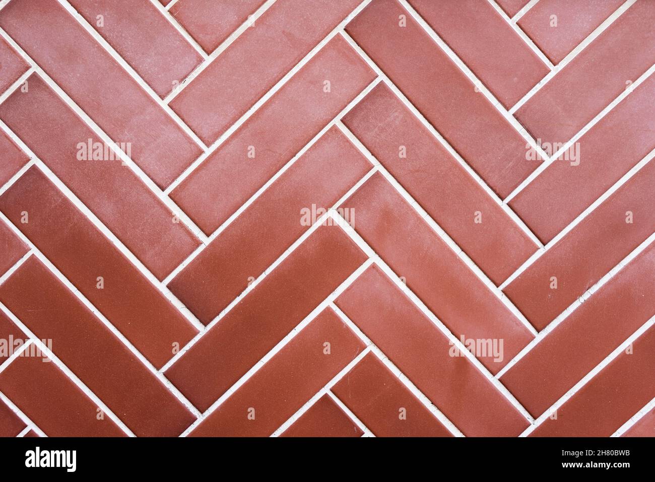 Textured background of a wall made of bricks placed in a diagonal ...