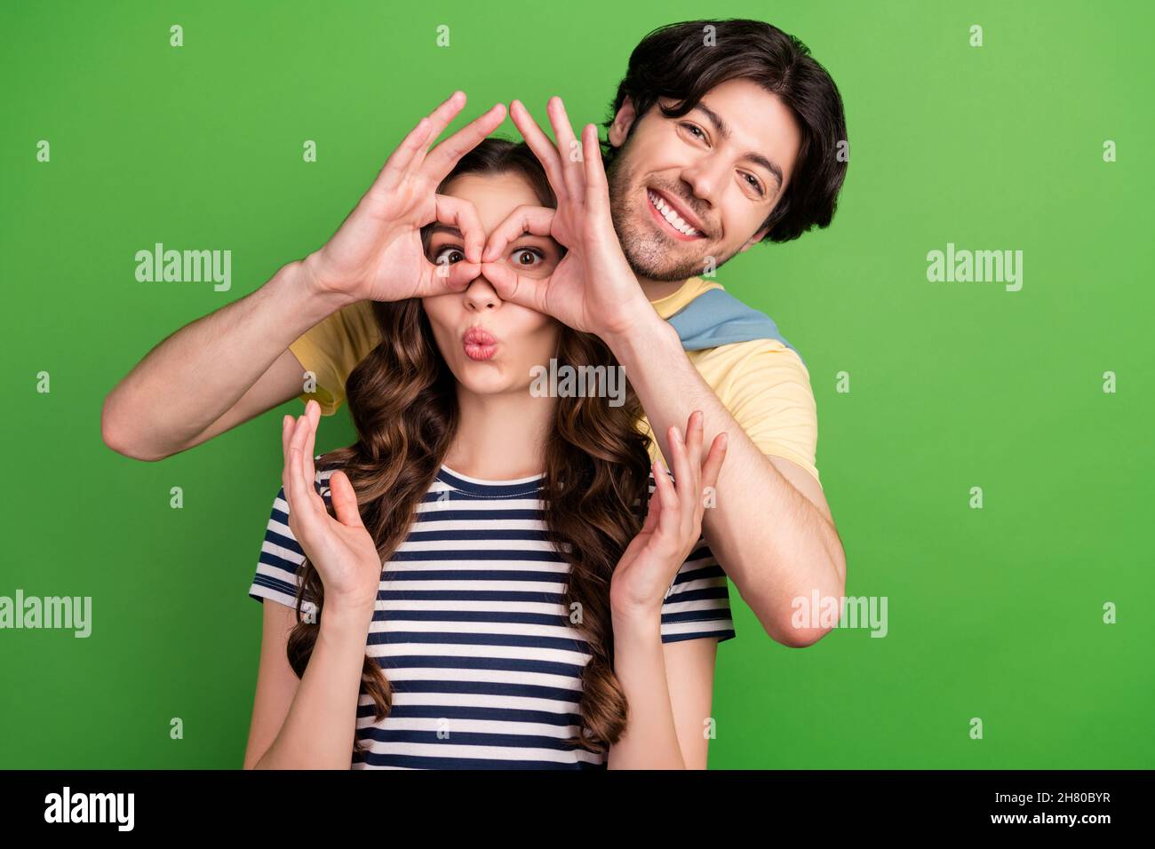 Photo of young crazy couple happy positive smile make fingers ...