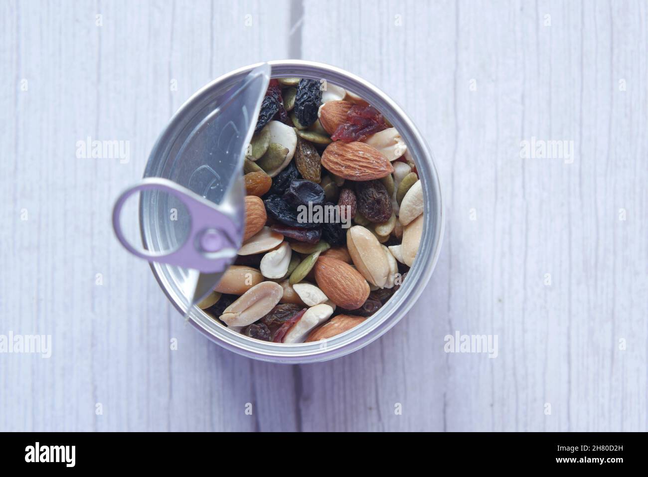 close up of many mixed nuts in a container Stock Photo - Alamy