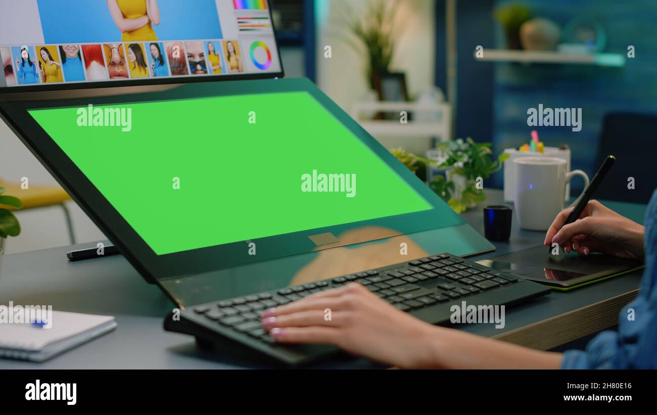 Close up of horizontal green screen on computer with retouching app ...