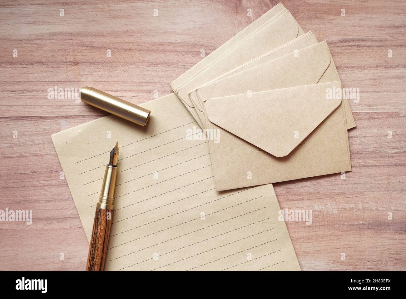 envelope , empty paper and fountain pen on table Stock Photo - Alamy