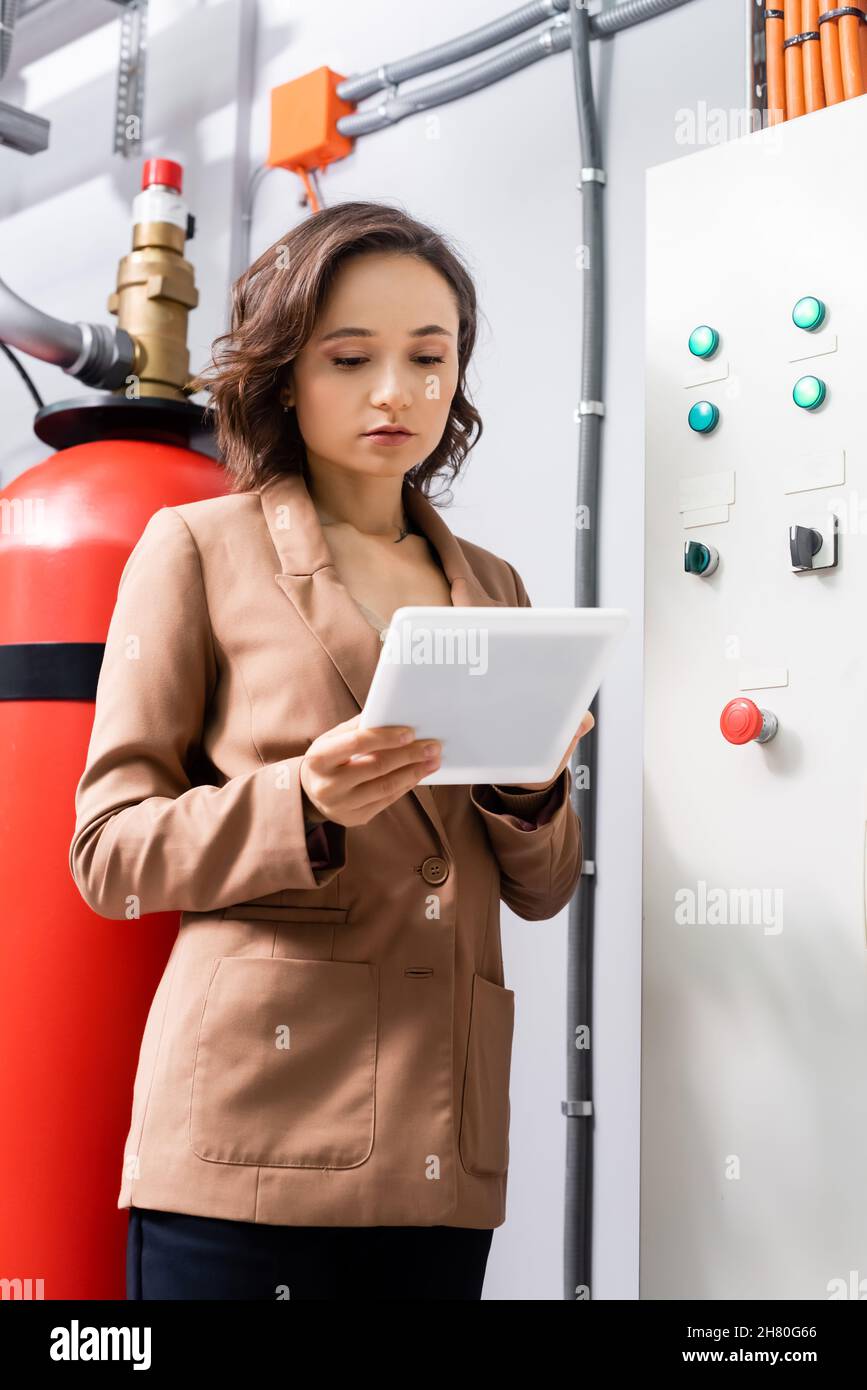 engineer using digital tablet near switchboard in data center Stock ...