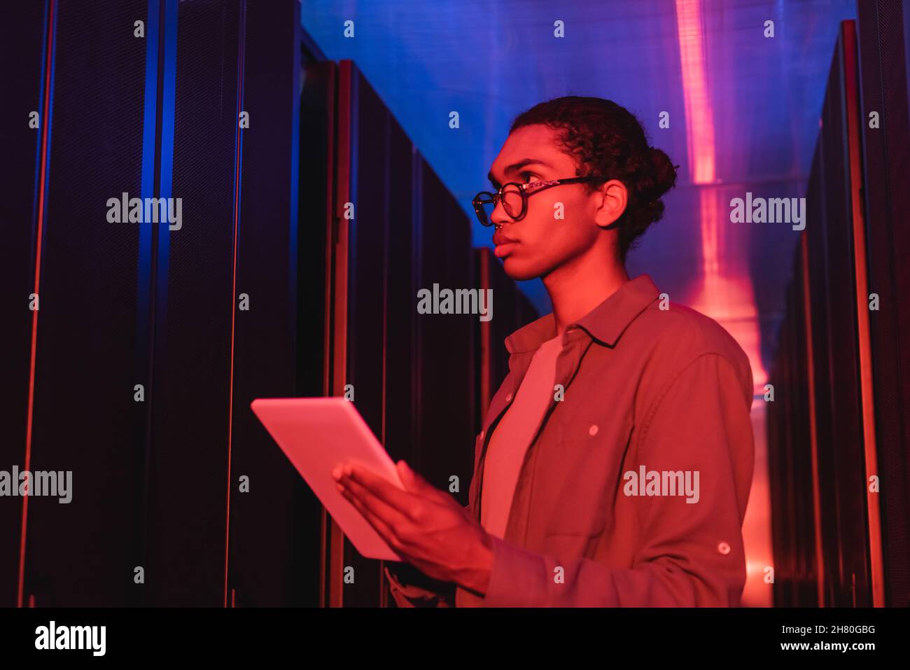 young african american programmer with digital tablet working near ...