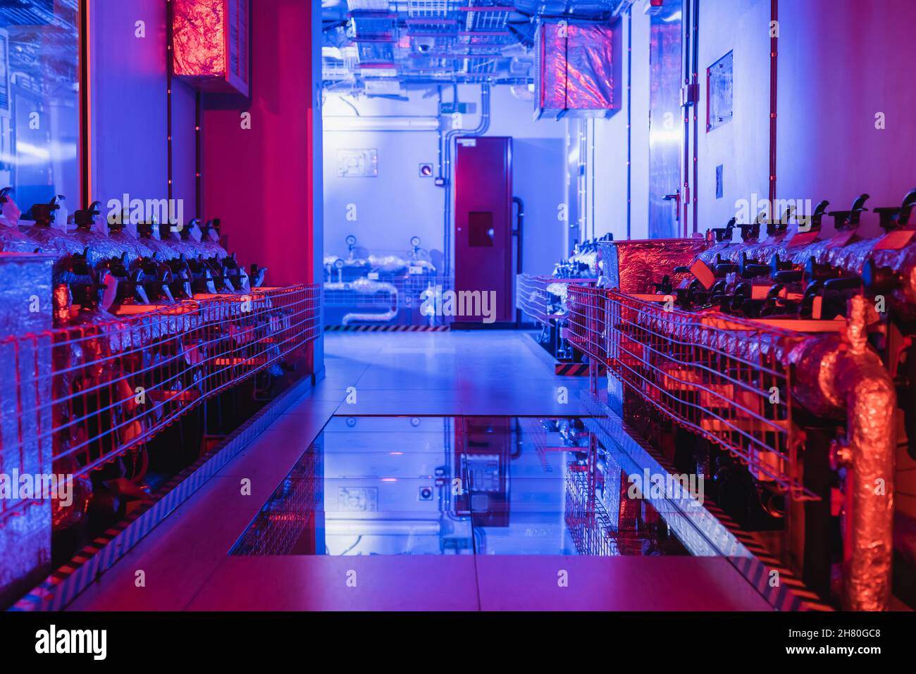 technical equipment and cooling system of data center in room with neon ...