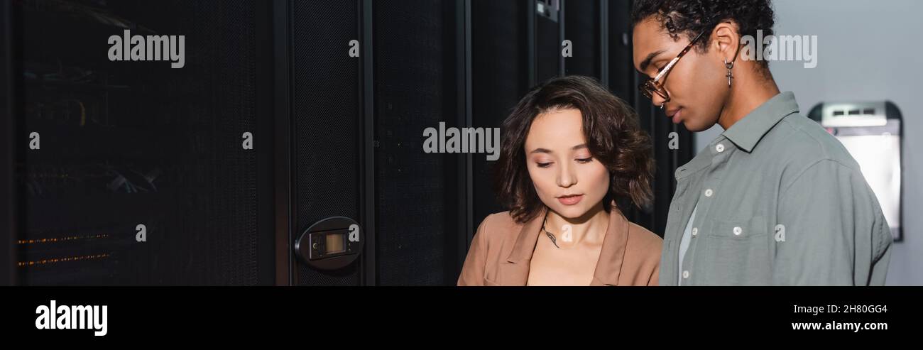 Multiethnic couple data engineers working hi-res stock photography and ...
