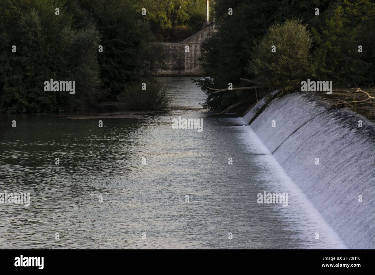 Landscape view of a reservoir surrounded by trees Stock Photo - Alamy