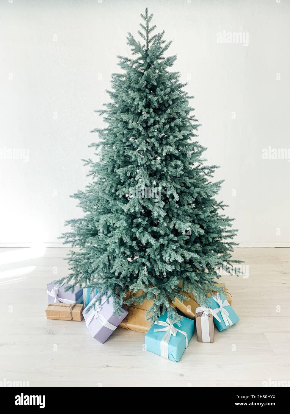 Christmas tree with loft gifts Christmas decor Stock Photo - Alamy