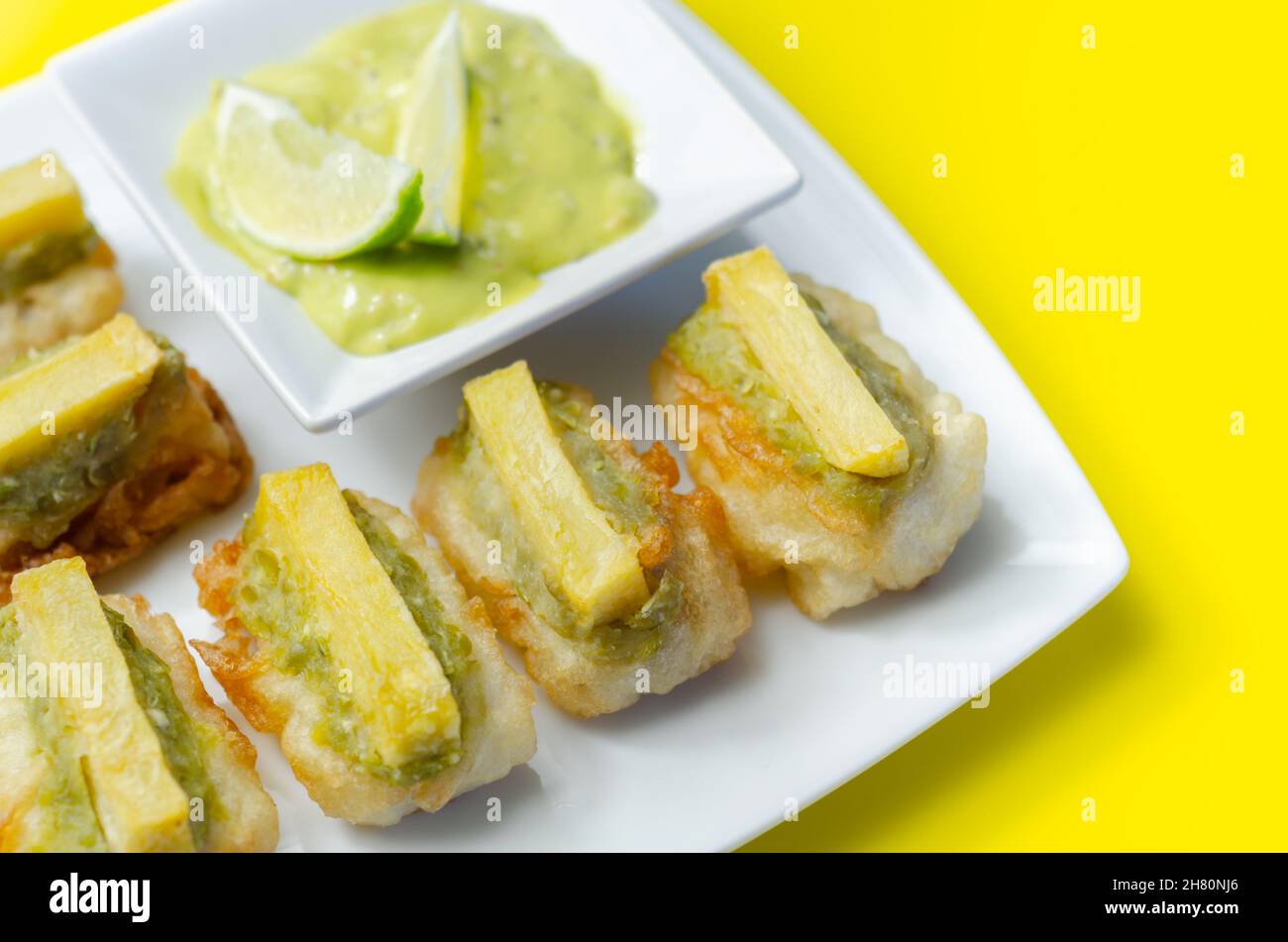 Skinless and boneless battered Alaska Pollock fillet pieces, topped ...